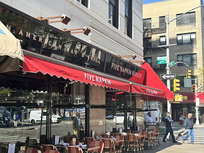 The corner location offers a quintessential New York moment—great food meets bustling city life. Those red awnings practically wink at passersby.
