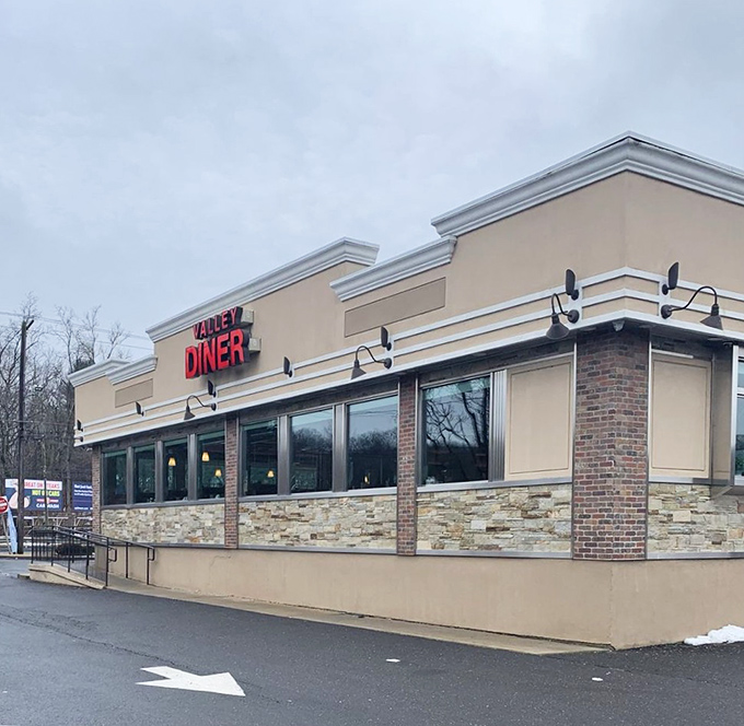 That classic diner profile – large windows letting in natural light, stone and brick accents, and the iconic sign announcing your arrival at comfort food headquarters.