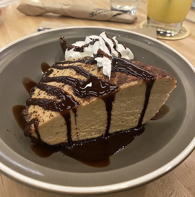 Peanut butter pie that makes time stand still. That chocolate drizzle isn't just garnish—it's the exclamation point on a perfect meal.