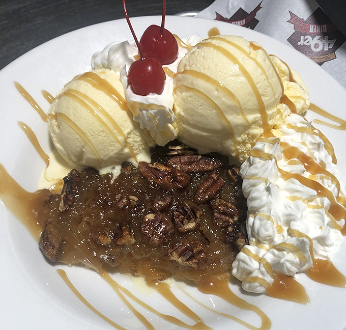 This isn't just dessert – it's pecan pie transformed into a celebration with ice cream, caramel, and cherries that make Tuesday feel like your birthday.