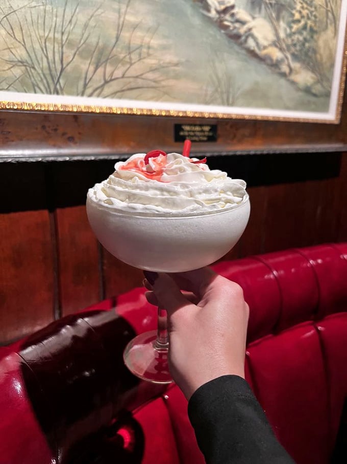 A dessert cocktail that doesn't apologize for its excess—whipped cream mountain atop a creamy concoction that says "vacation" with every sip.