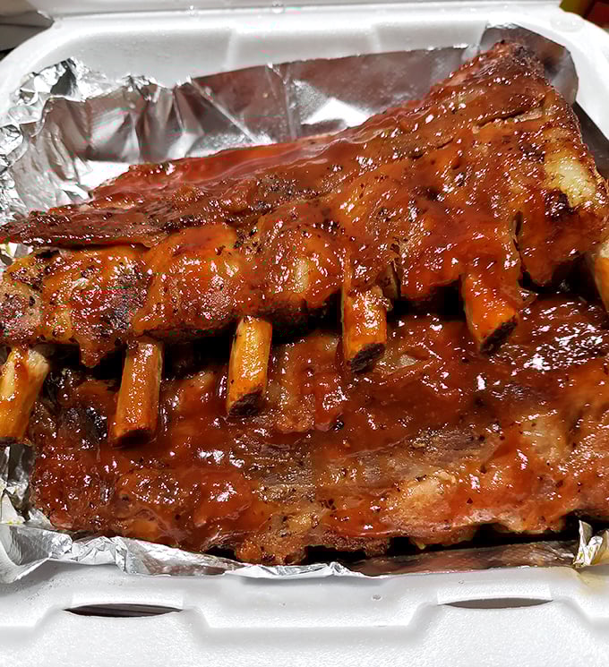 Ribs glistening with sauce that demands to be licked from fingers. No white tablecloths needed for this kind of dining bliss.