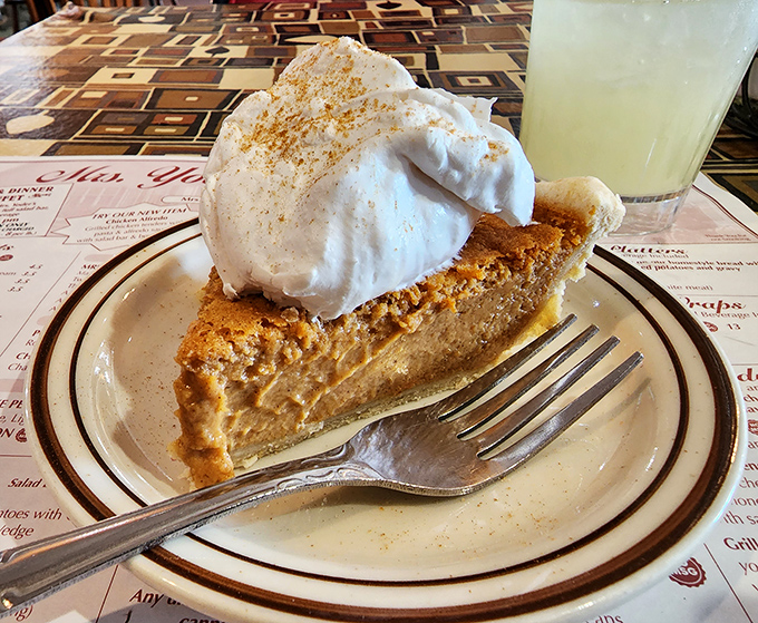 Pumpkin pie topped with a cloud of whipped cream. One forkful and you'll understand why pumpkin spice everything became a national obsession.