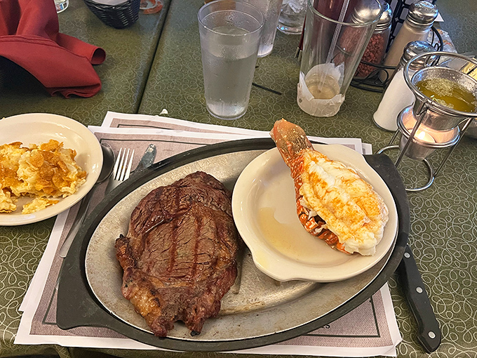 The ultimate power couple: a perfectly grilled ribeye alongside a butter-drenched lobster tail – date night never looked so delicious.