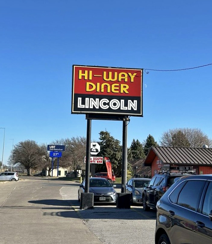 The sign stands tall against the Nebraska sky, a beacon of hope for hungry travelers and a landmark for locals giving directions.