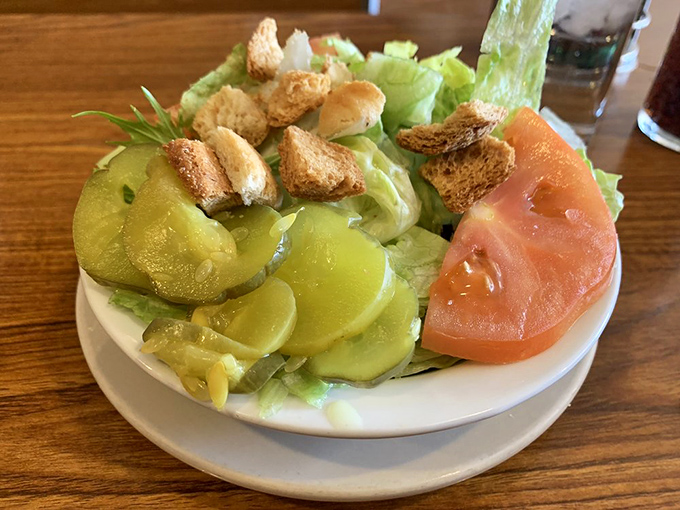 The side salad arrives like a colorful supporting actor—crisp, fresh, and perfectly dressed, ready to balance out the burger-and-pie extravaganza.