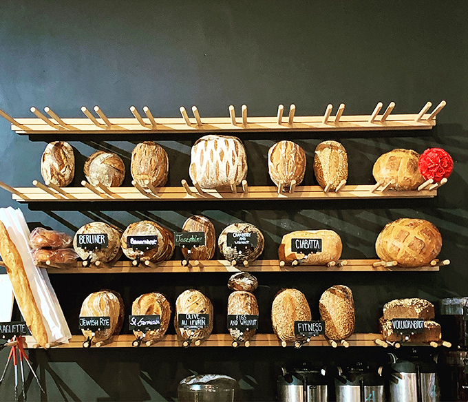 Bread displayed like the treasures they are, each loaf with its own personality and purpose. This isn't just baking—it's edible sculpture with soul.