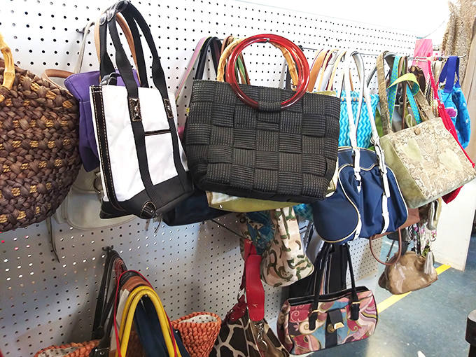 The handbag collection dangles with possibility—each purse a portable time capsule of fashion history waiting for its next shoulder to ride.