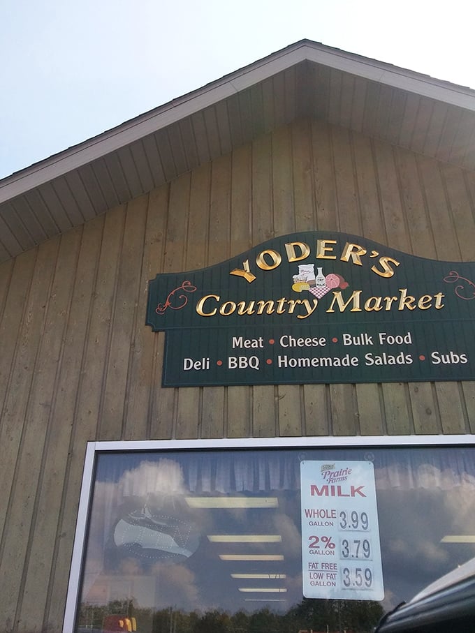 The sign says it all—meat, cheese, bulk food, deli, BBQ, homemade salads, and subs. No false advertising, just honest Amish country goodness.