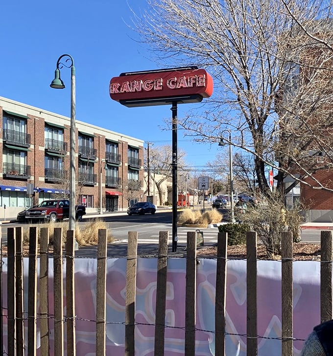 The Range Cafe sign stands as a landmark against Albuquerque's brilliant blue sky—a beacon for those seeking the legendary mac and cheese within.