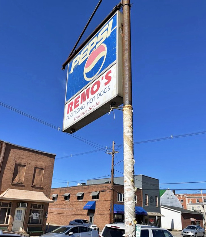 The weathered sign stands as a beacon of hope for hungry travelers – proof that some treasures aren't meant to be hidden.