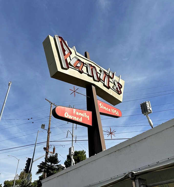 That magnificent neon sign has been guiding hungry Angelenos home since 1958. It doesn't just advertise a restaurant—it announces an institution.