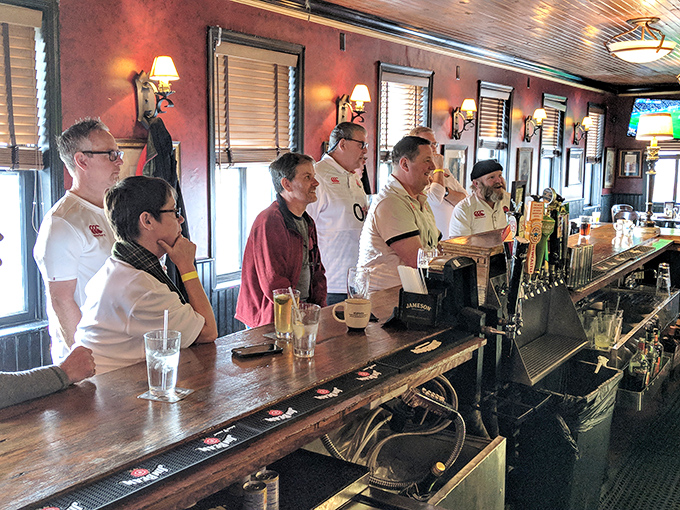 The front line of hospitality stands ready at Slainte's bar—guardians of good times and perfect pours awaiting your next order.