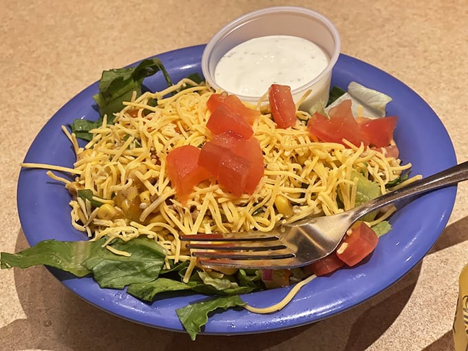 A vibrant taco salad that nods respectfully to health consciousness while still hanging out with the cool kids at Dirty Frank's flavor party.