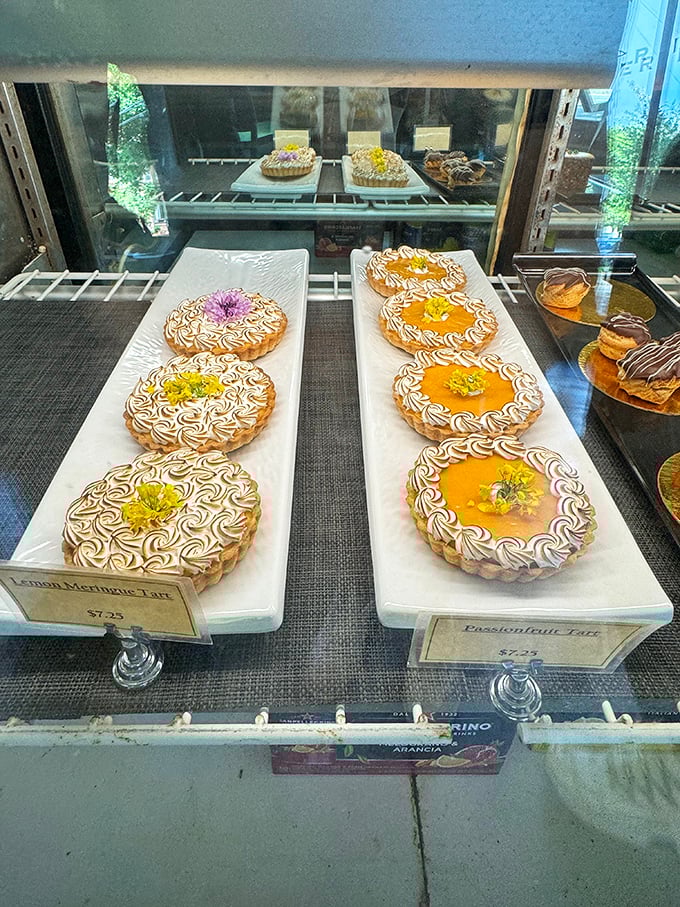 Tarts lined up like jewels in a display case, each one promising a different path to dessert enlightenment.