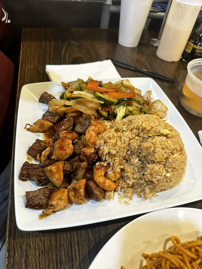 The surf and turf platter with fried rice—proof that sometimes you don't have to choose between land and sea when you can conquer both territories.