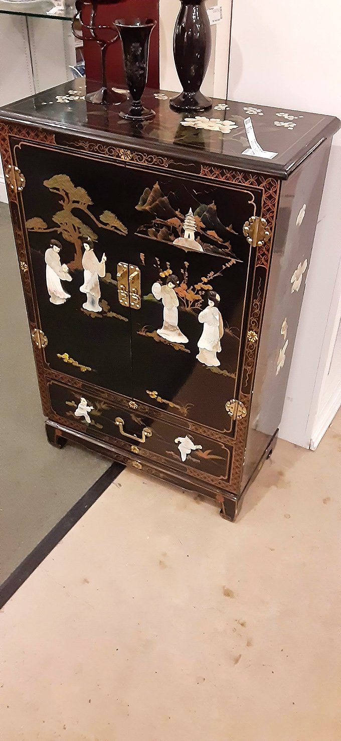 This isn't just a cabinet—it's functional art telling stories of distant lands while secretly judging your storage solutions at home.