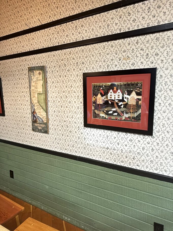 Country-charm wallpaper and folk art create the perfect atmosphere for serious pie contemplation. Calories don't count in rooms this cozy.