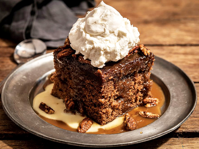The legendary namesake dessert that launched it all. Bourbon-soaked toffee cake swimming in anglaise with fresh whipped cream—resistance is futile.