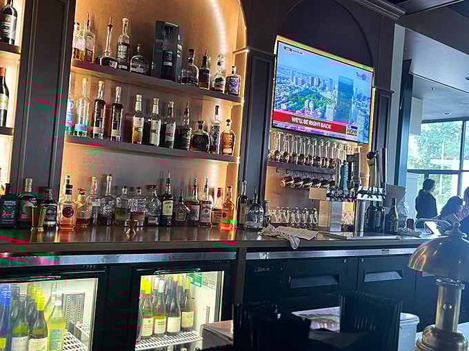 A bar stocked for serious sipping – where bourbon bottles stand like soldiers ready to defend against ordinary drinking experiences.