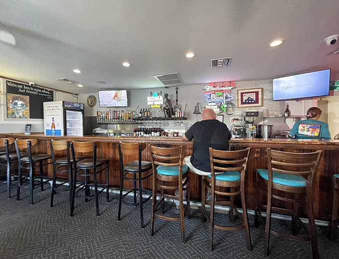 The bar where locals gather to swap fishing tales while waiting for their chowder—some stories getting taller with each round, just as tradition demands.