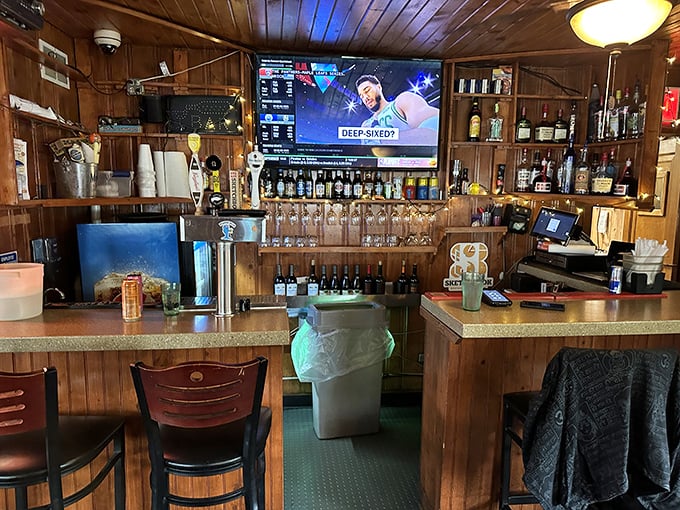 The bar at Pequod's isn't just where drinks are served—it's command central for pizza operations and the perfect spot to debate Chicago pizza superiority.