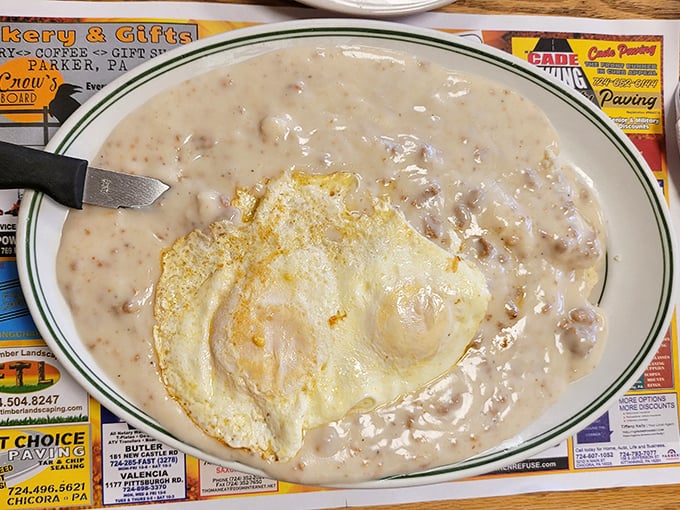 Biscuits and gravy with a sunny-side-up egg – the breakfast equivalent of finding money in your winter coat pocket: unexpected joy on a plate.