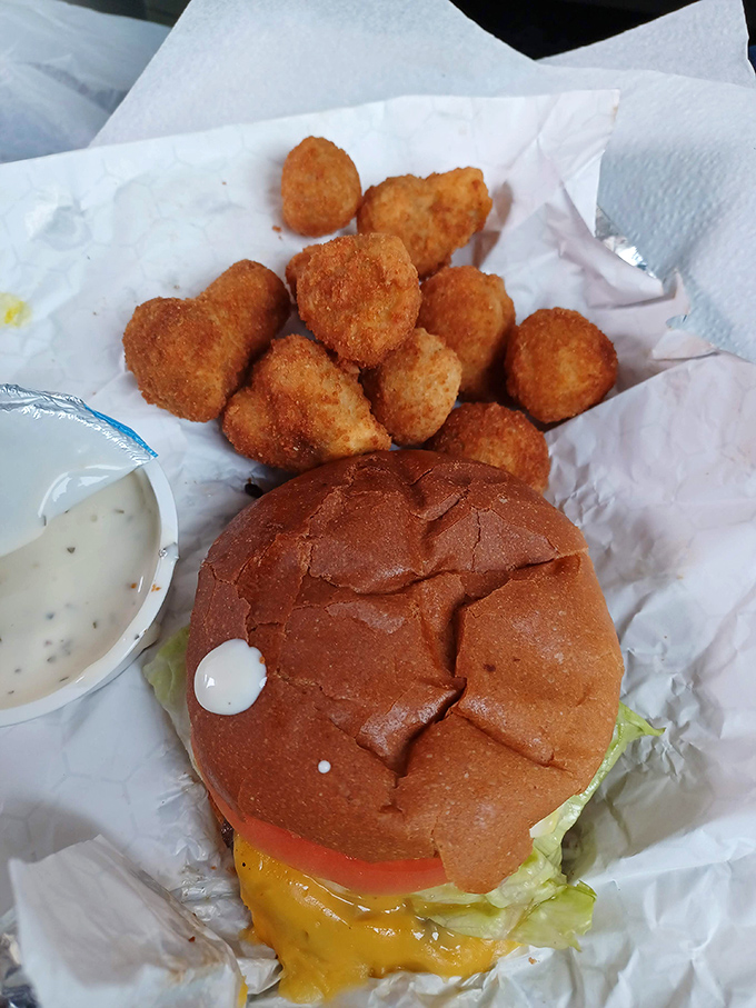 The perfect burger doesn't exi—wait, there it is, nestled beside golden potato puffs and waiting to make your day measurably better.