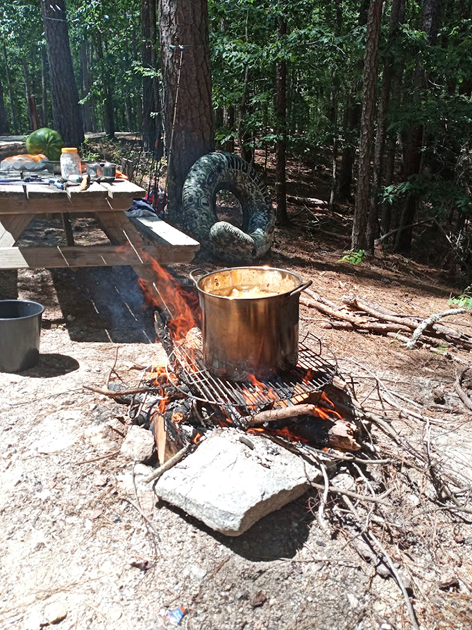 Campfire cooking at its primal best—where a bubbling pot over crackling flames somehow makes everything taste better than any five-star restaurant.