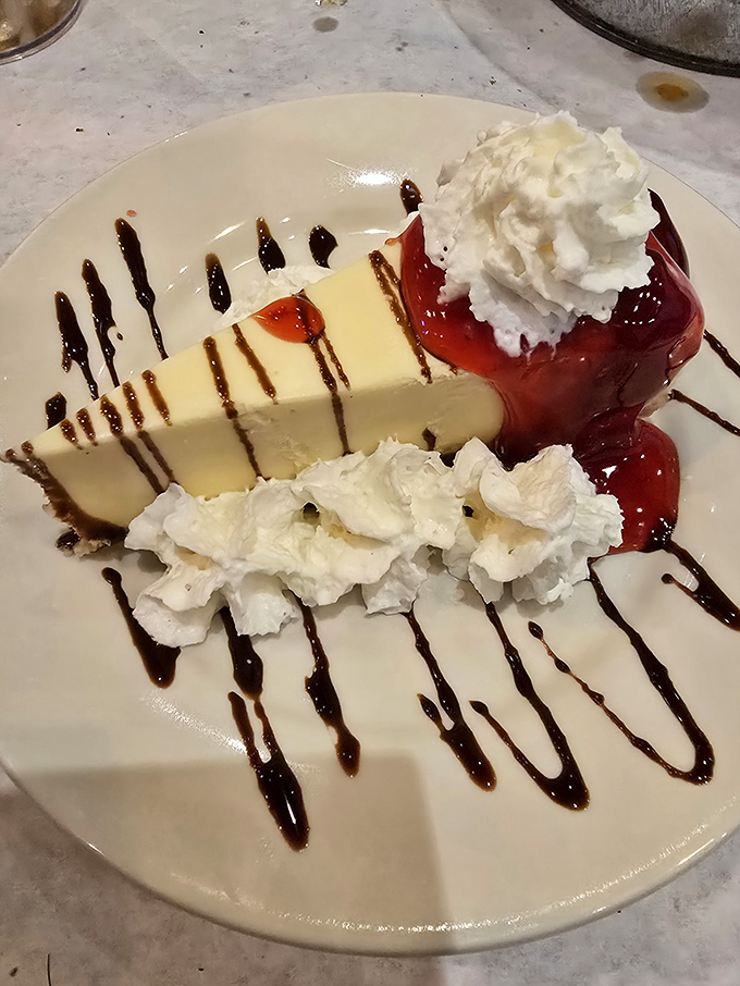Cheesecake: the sweet finale that somehow finds room in stomachs already filled with seafood—proof that dessert occupies its own special compartment.