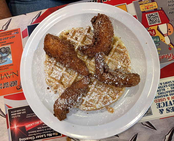 Chicken and waffles—where breakfast and dinner hold hands and jump into deliciousness together. The powdered sugar dusting is just showing off.