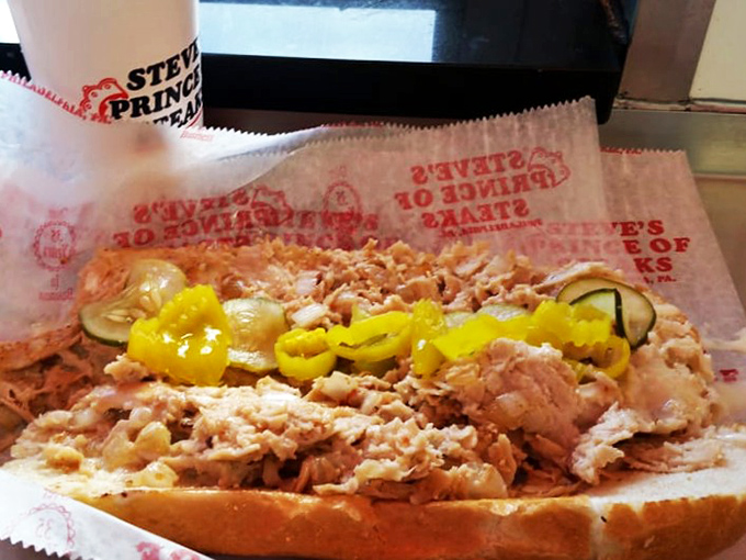 The chicken cheesesteak—lighter but no less regal. Tender poultry adorned with peppers and cheese proves that alternative royalty can rule just as well.