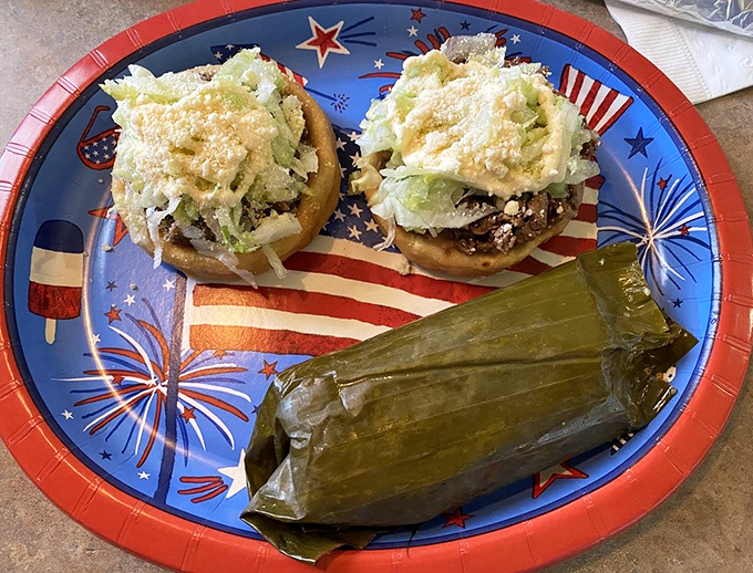A patriotic plate holding the diplomatic relations between cultures—traditional tamales and sopas creating an international summit of flavors worth celebrating.