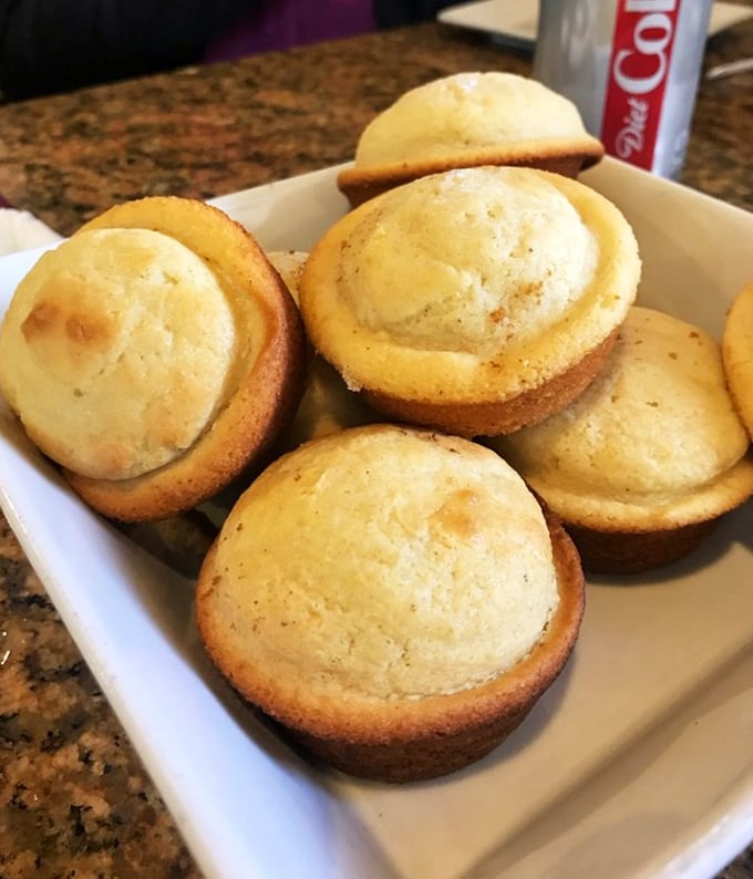 Cornbread muffins with golden domes and tender centers – the perfect supporting actors that sometimes steal the whole show.