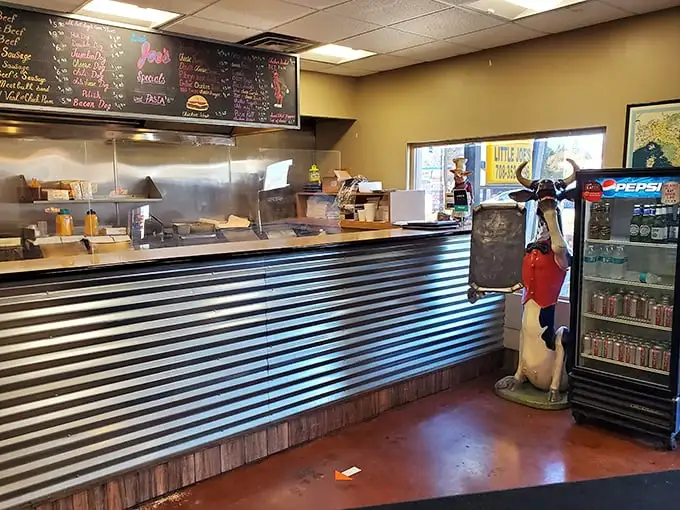 The ordering counter—where dreams come true and diets go to die. That cow statue knows exactly what you're about to do.