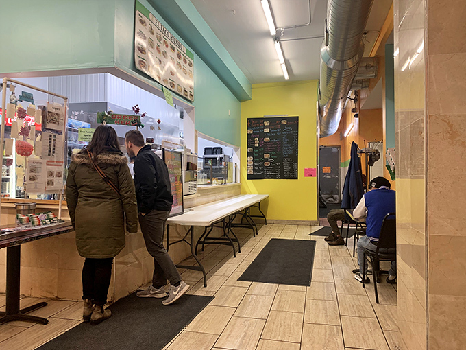 The ordering counter—where dreams are placed and fulfilled. That menu on the wall isn't just decoration; it's a promise of good things to come.