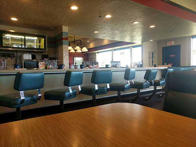 The counter—where solo diners become regulars, servers become friends, and the coffee cup is never empty for more than 30 seconds.