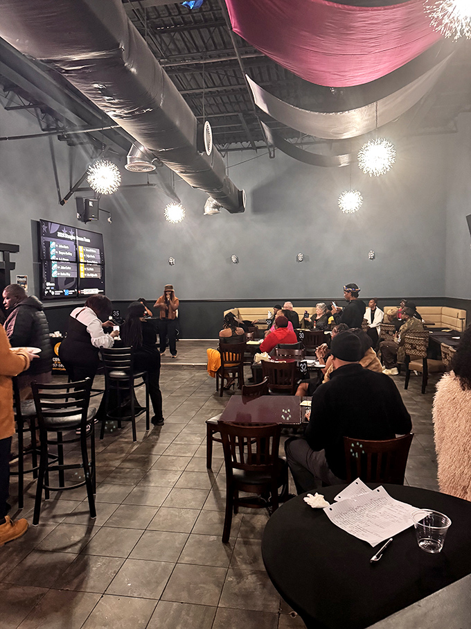 A bustling dining room where strangers become temporary neighbors, united by the universal language of exceptional food. 