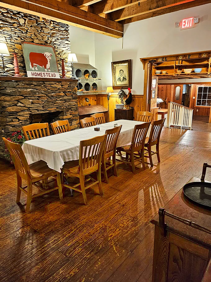 A dining room where memories are made between bites. Stone fireplace, wooden chairs, and tables set for feasting—Norman Rockwell would feel right at home.
