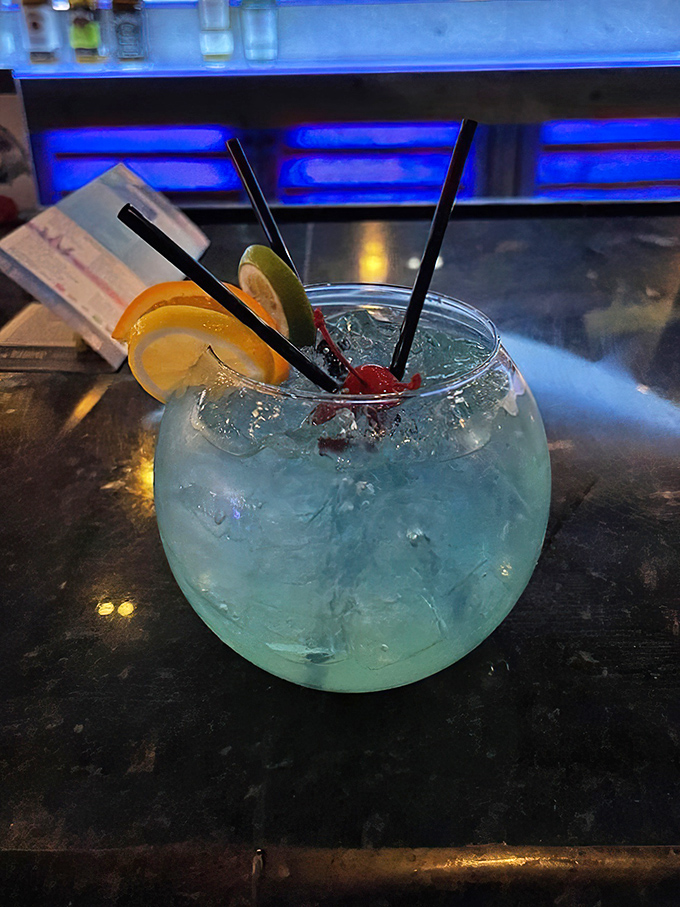 A fishbowl drink at the Fish Bowl—meta and refreshing. This blue concoction is what mermaids order when they're off duty.