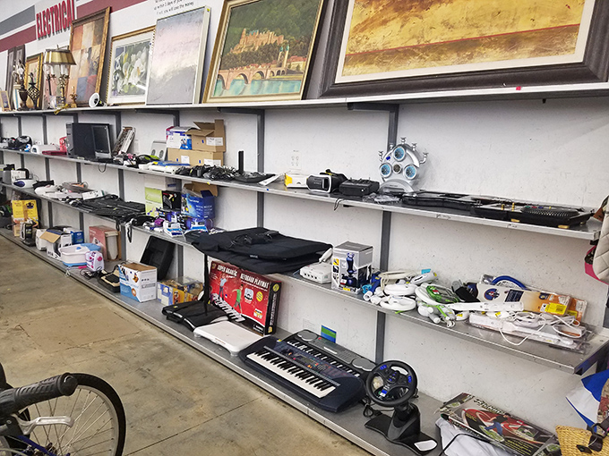 The electronics graveyard, where yesterday's cutting-edge technology comes to find its second life. That keyboard might have composed a hit song in its previous incarnation.