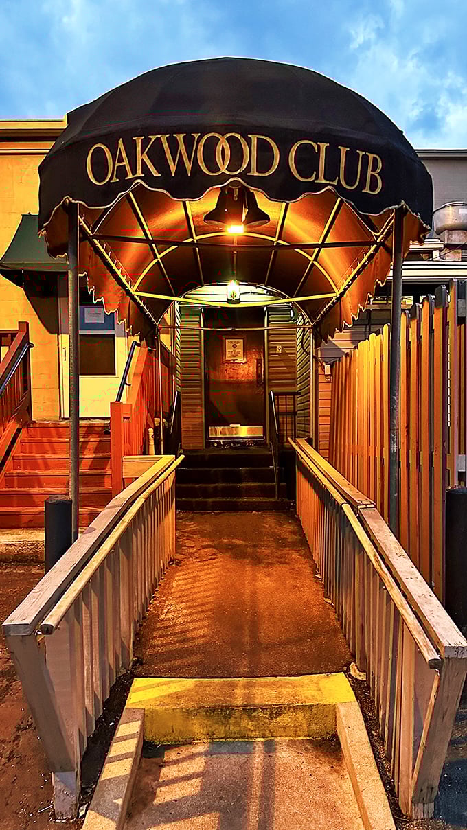 The entrance ramp at night feels like the gateway to a delicious adventure—follow the golden light to steak nirvana.