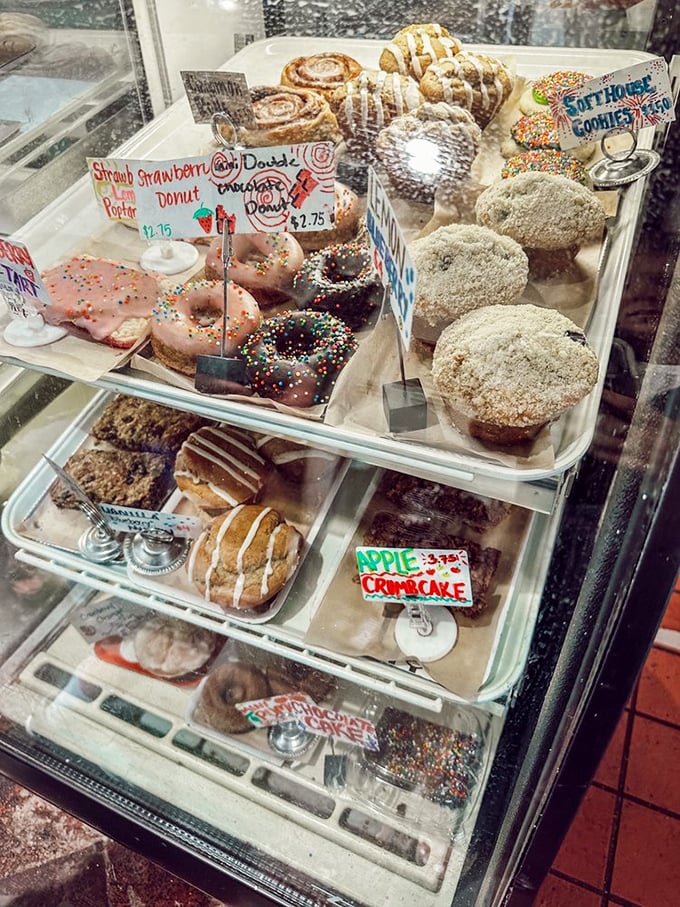 The display case at Mud Pie is essentially Willy Wonka's factory for grown-ups—except everything is plant-based and no one turns into a blueberry.