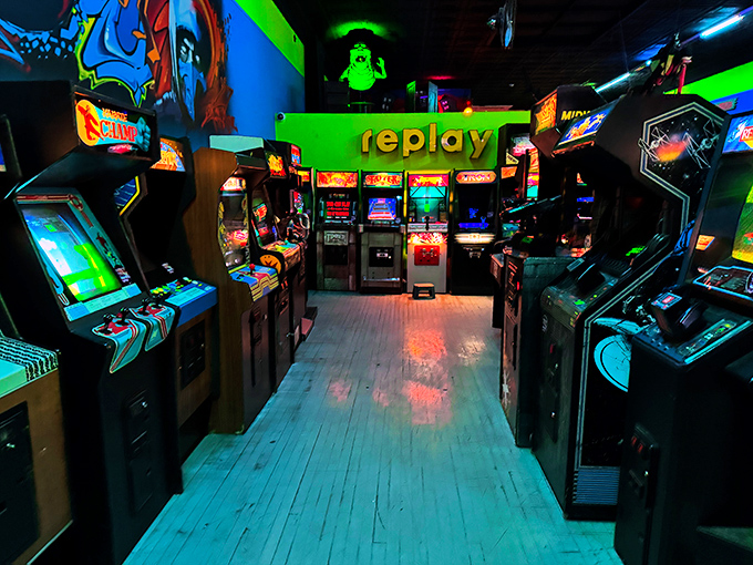 Corridors of cabinets create a maze of gaming possibilities. Each machine stands ready to transport players back to simpler times—one quarter at a time.