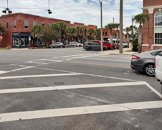 Brick buildings and palm trees frame Apalachicola's downtown intersections, where stopping to chat isn't holding up traffic – it's practically required.