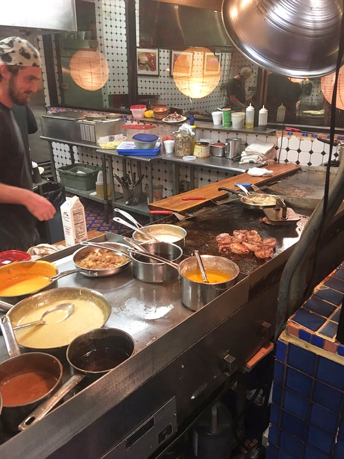 Where the magic happens – a bustling kitchen with sauces simmering and steaks sizzling, the culinary engine behind this colorful mountain gem.