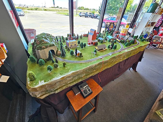 Miniature worlds capture big imagination—this meticulously crafted model train setup makes you feel like a benevolent giant overlooking a tiny town.