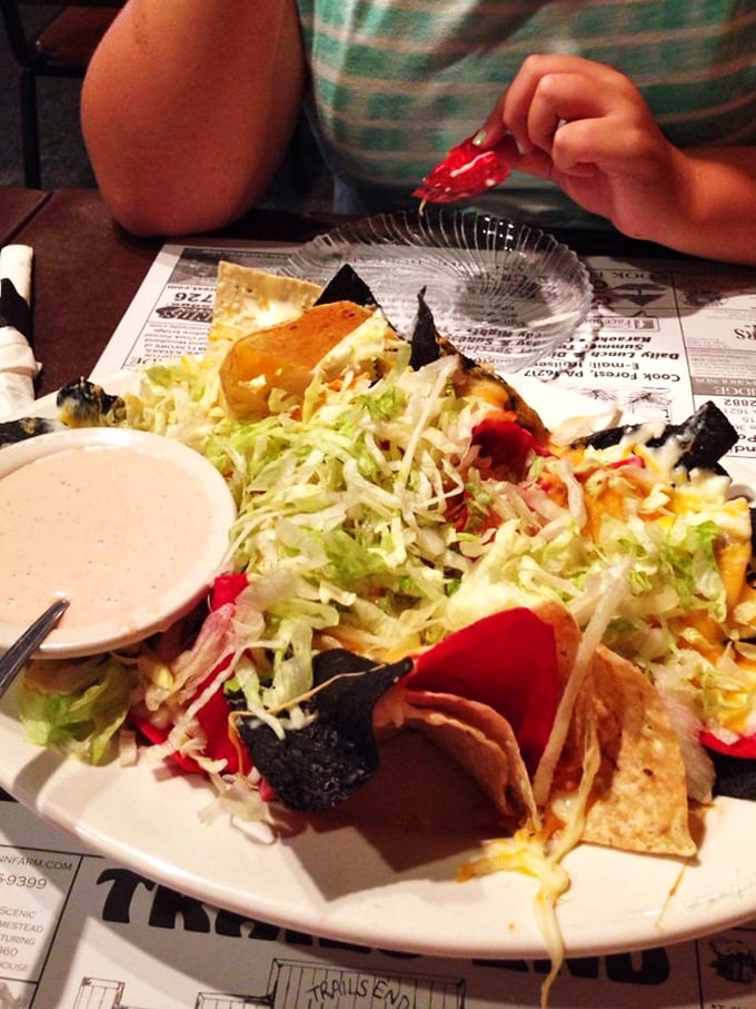 Nachos that require a strategy to eat properly. This isn't just an appetizer—it's an edible puzzle where every solution is deliciously correct.