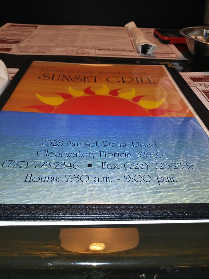 The menu cover reveals all you need to know – location, hours, and that sunny logo that's become a beacon for breakfast lovers.