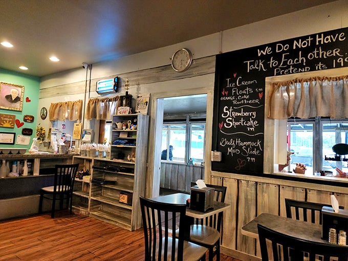 Whimsical chalkboard menus and weathered wood walls tell stories of countless meals shared. The "We Do Not Talk to Each Other" sign suggests a humor as homegrown as the food.